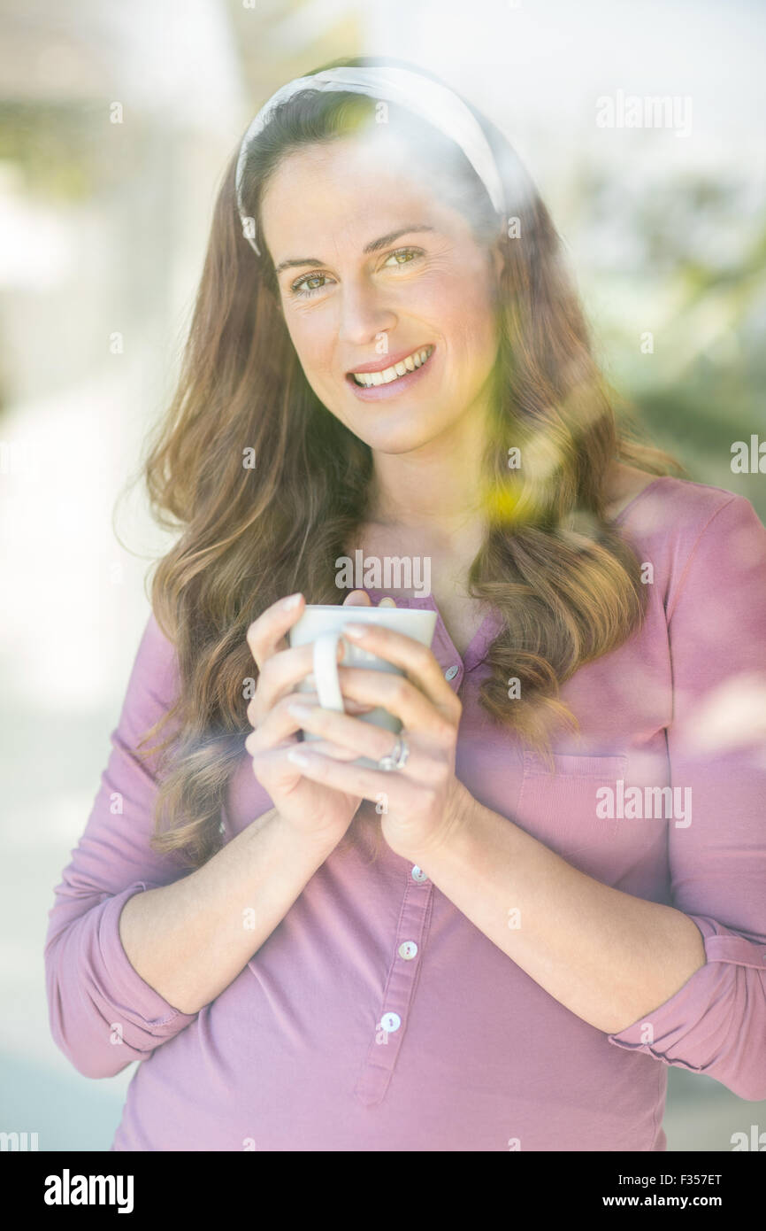 Portrait of happy woman with coffee Stock Photo - Alamy