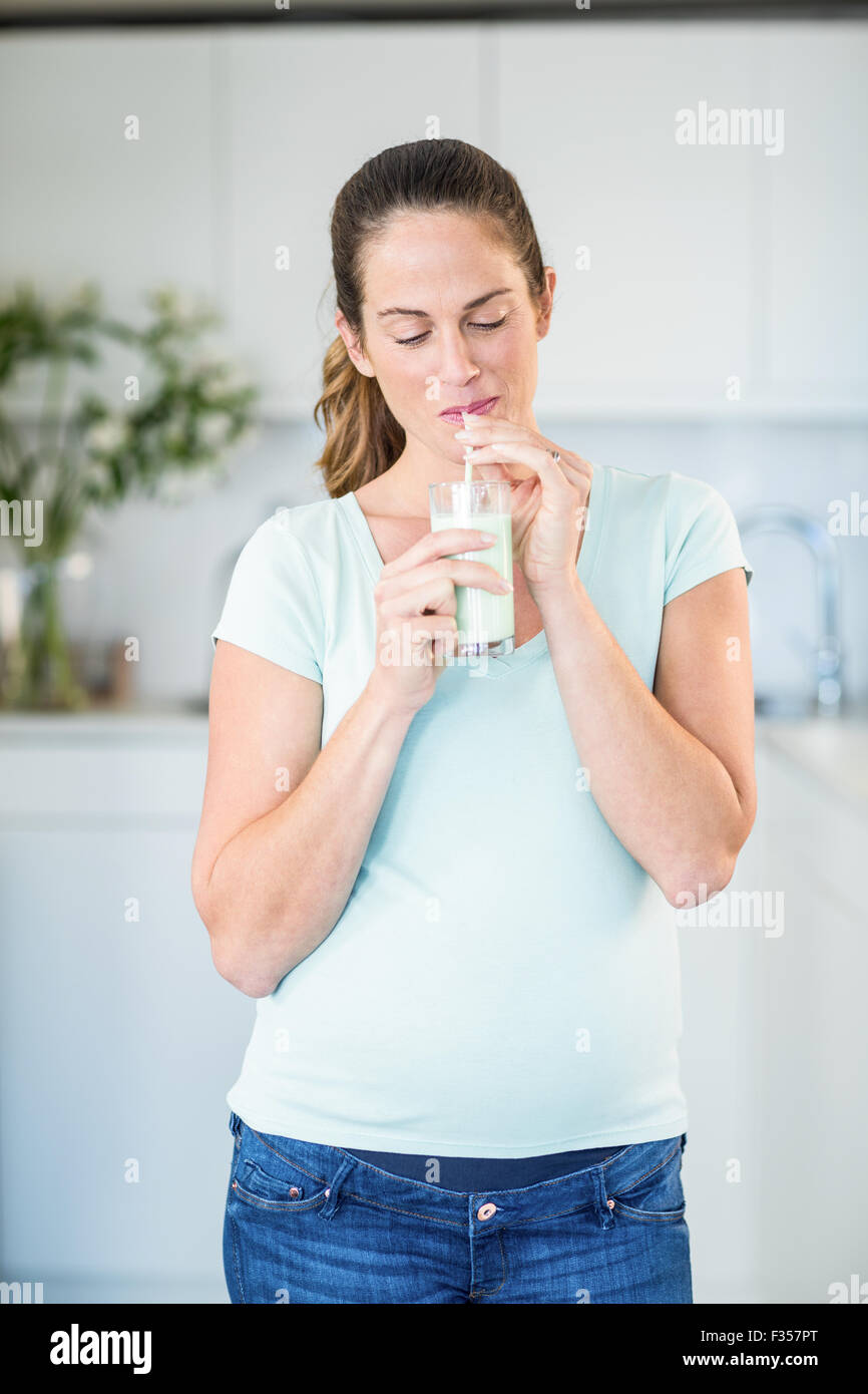 Happy woman enjoying juice Stock Photo - Alamy