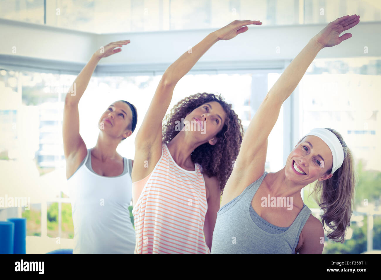 Sport women with arm raised Stock Photo - Alamy