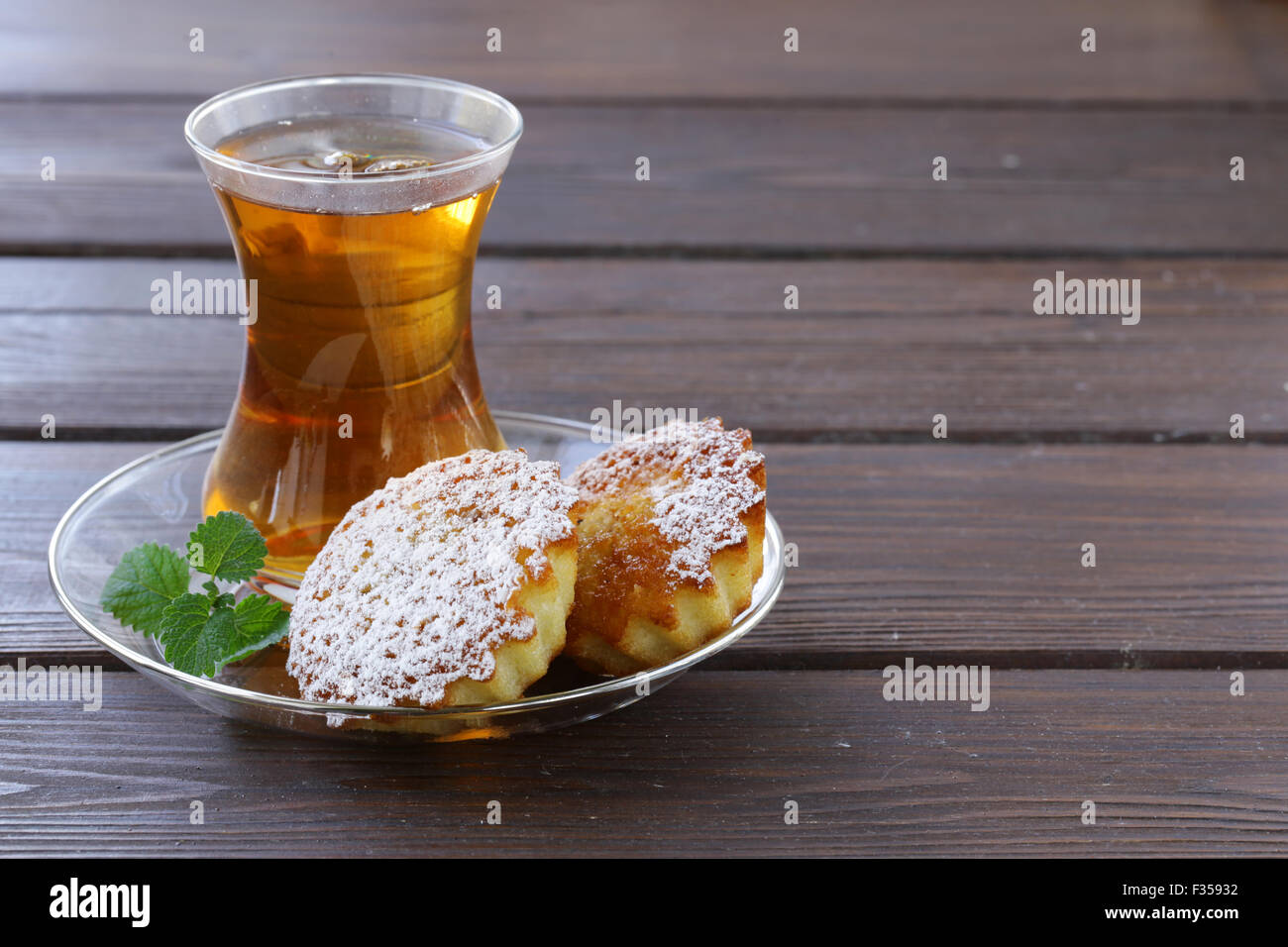 Turkish tea with a mini biscuits cupcake Stock Photo - Alamy