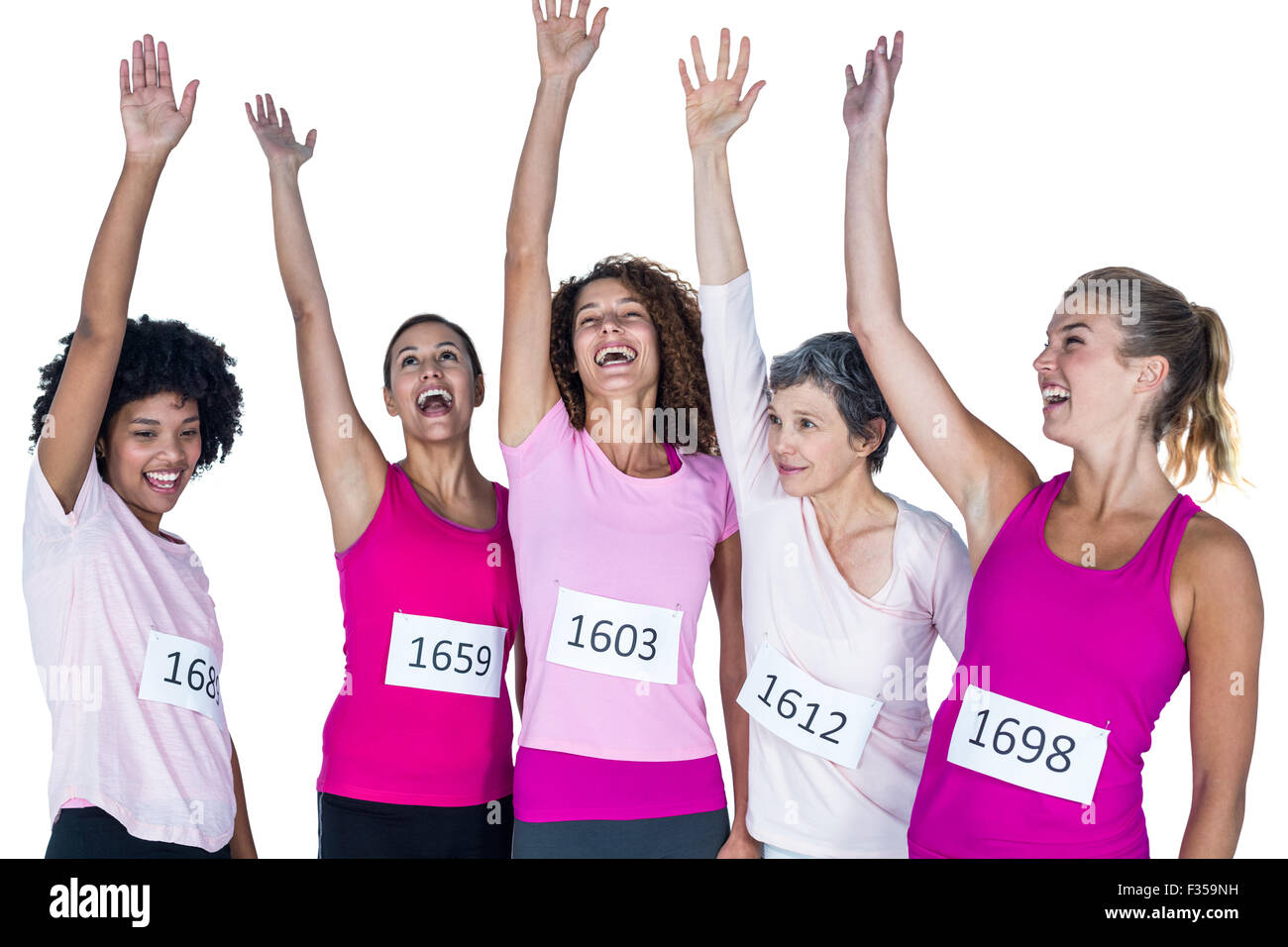 Cheerful female athletes with arms raised Stock Photo - Alamy