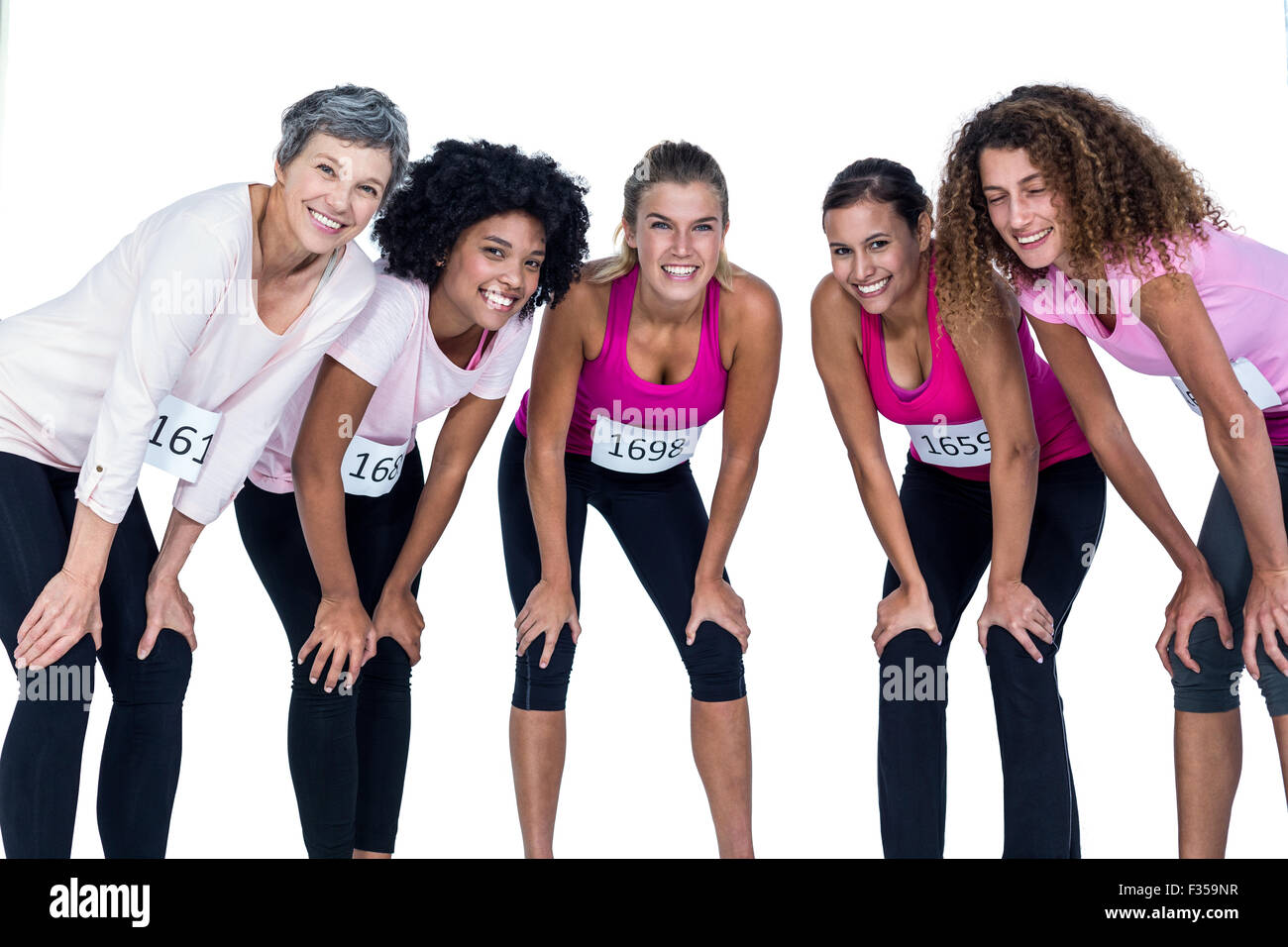 Portrait of smiling athletes bending Stock Photo - Alamy