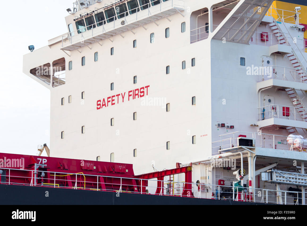 Cargo ship deck close up with safety inscription Stock Photo - Alamy