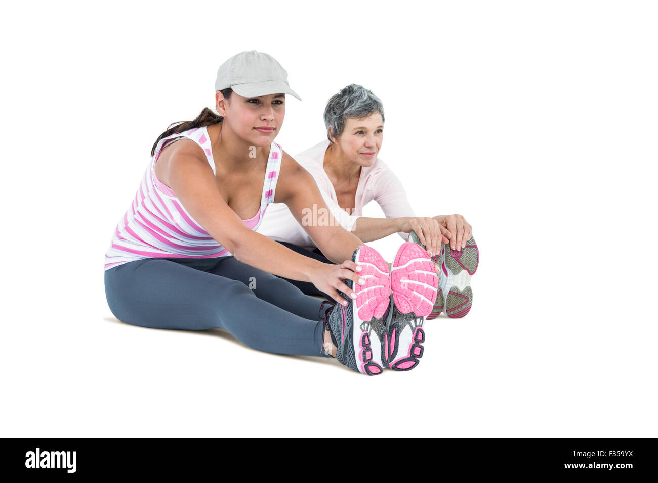 Women touching toes while exercising Stock Photo - Alamy
