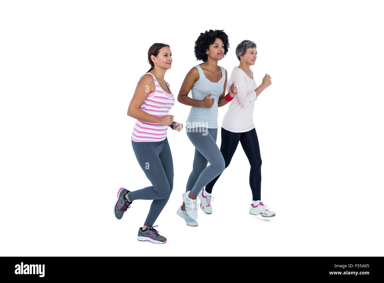 Female friends jogging together Stock Photo - Alamy