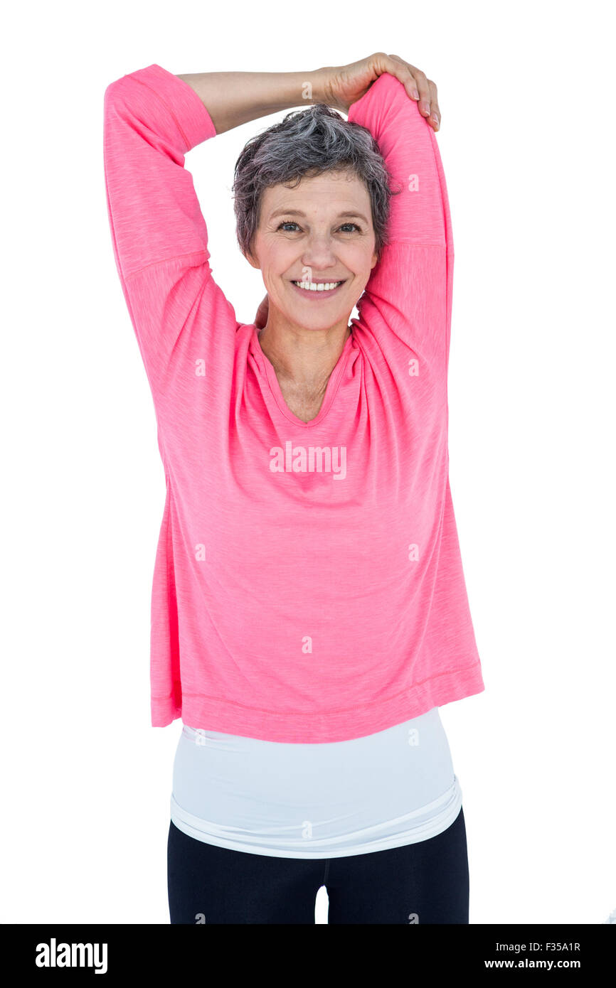 Portrait of happy woman stretching Stock Photo - Alamy