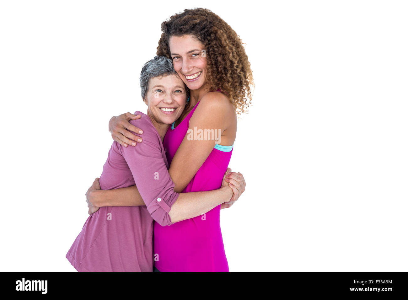 Portrait of cheerful daughter hugging mother Stock Photo - Alamy