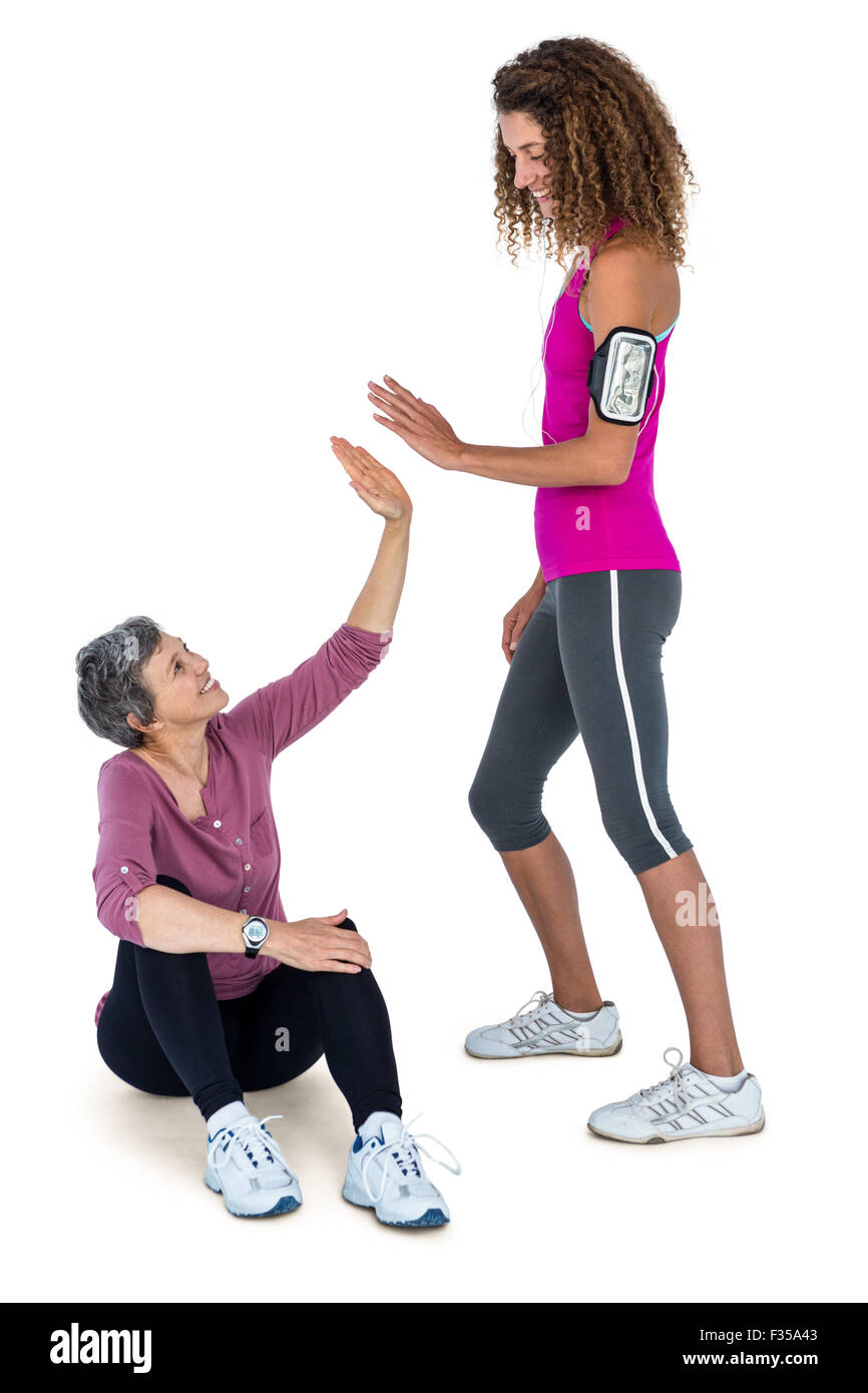 Cheerful female friends high fiving hi-res stock photography and images ...