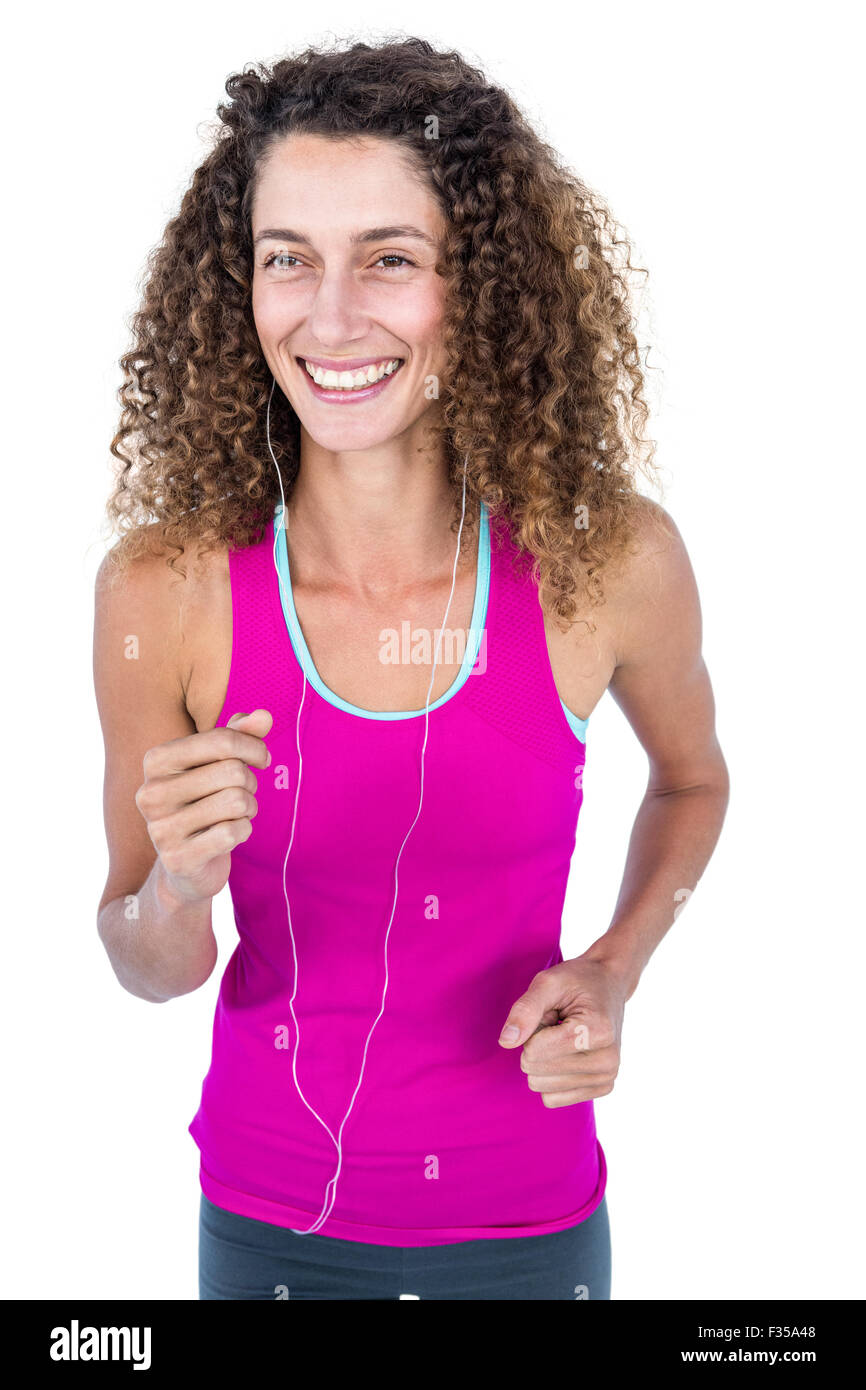 Attractive happy woman jogging Stock Photo - Alamy