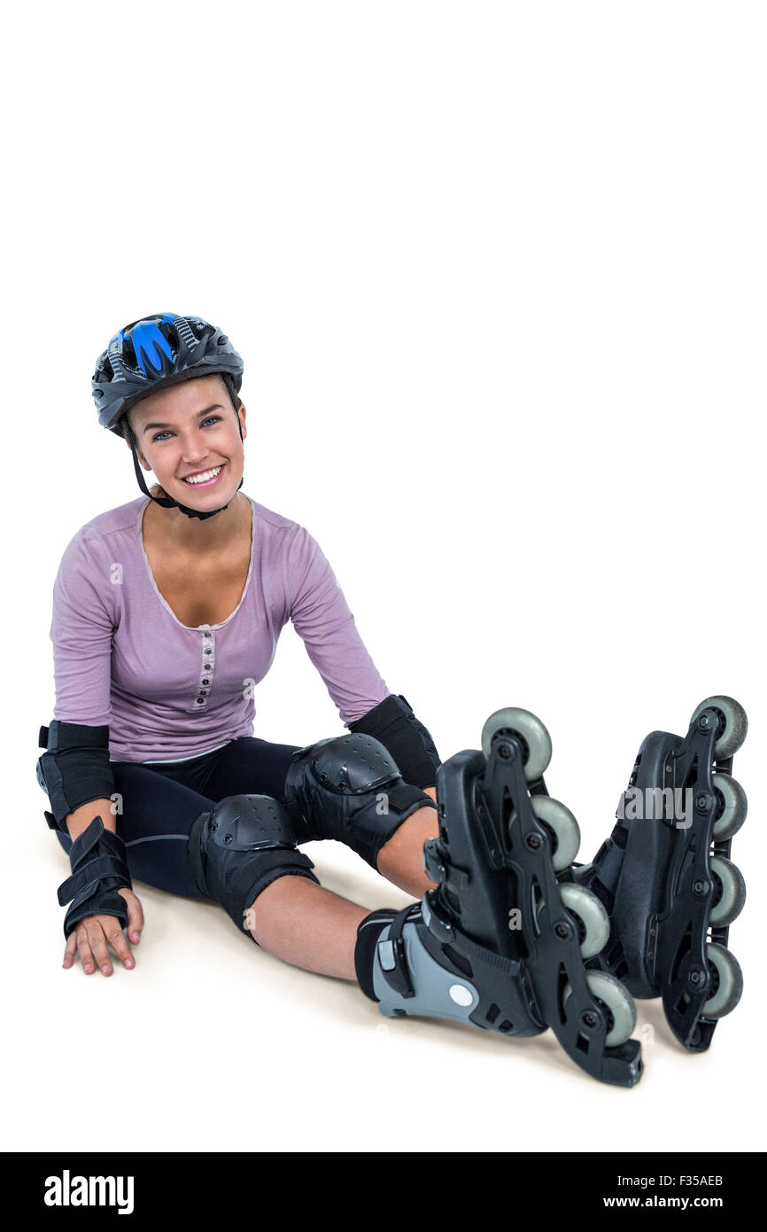 Portrait of happy female inline skater resting Stock Photo - Alamy