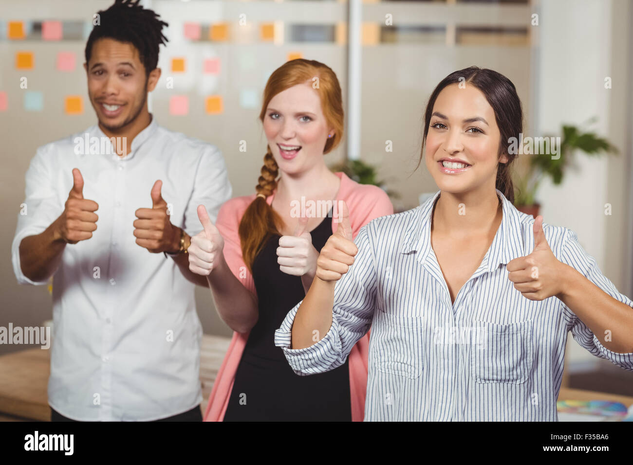Business people showing thumbs up hi-res stock photography and images ...