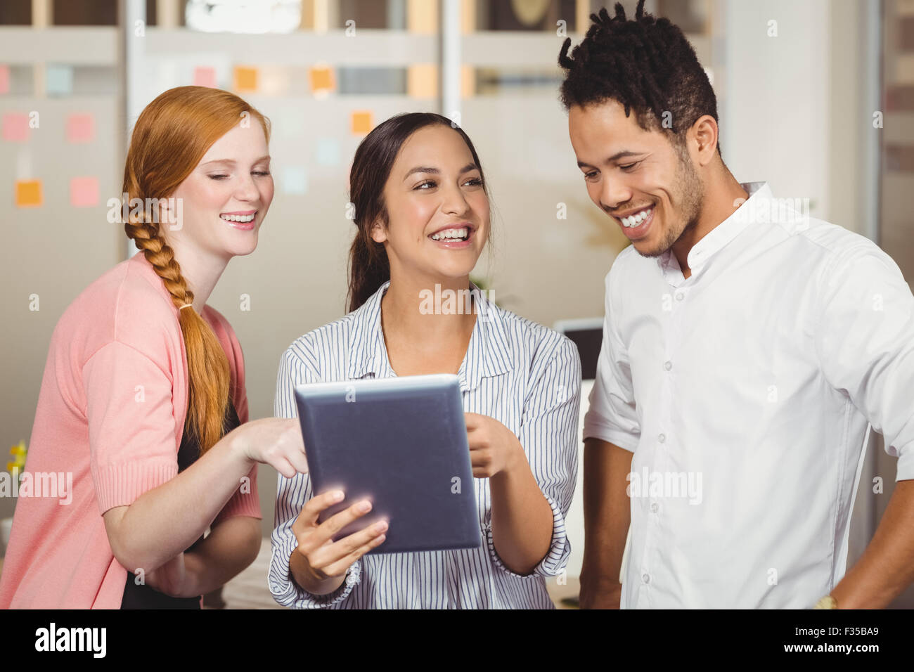 Black woman laughing smiling tablet hi-res stock photography and images - Alamy