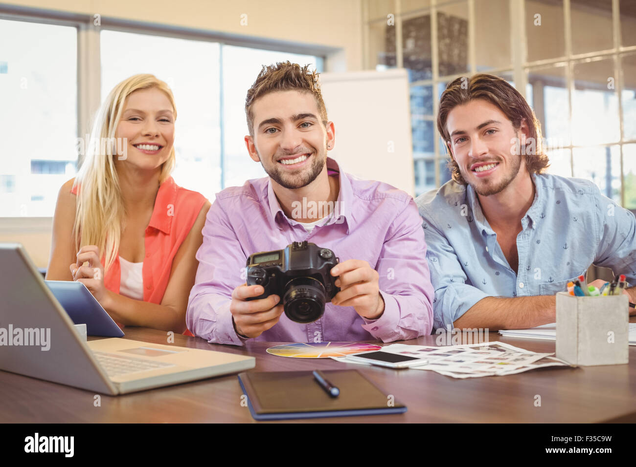 Business people with camera and laptop Stock Photo - Alamy