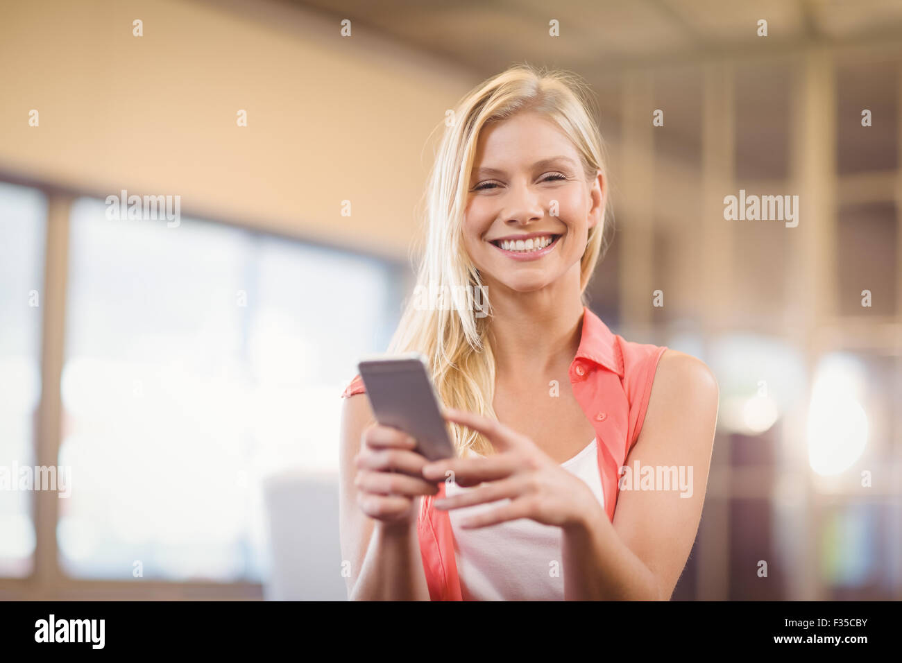 Beautiful businesswoman using phone Stock Photo - Alamy