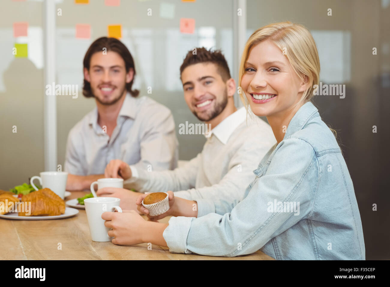 Business people having snack Stock Photo - Alamy