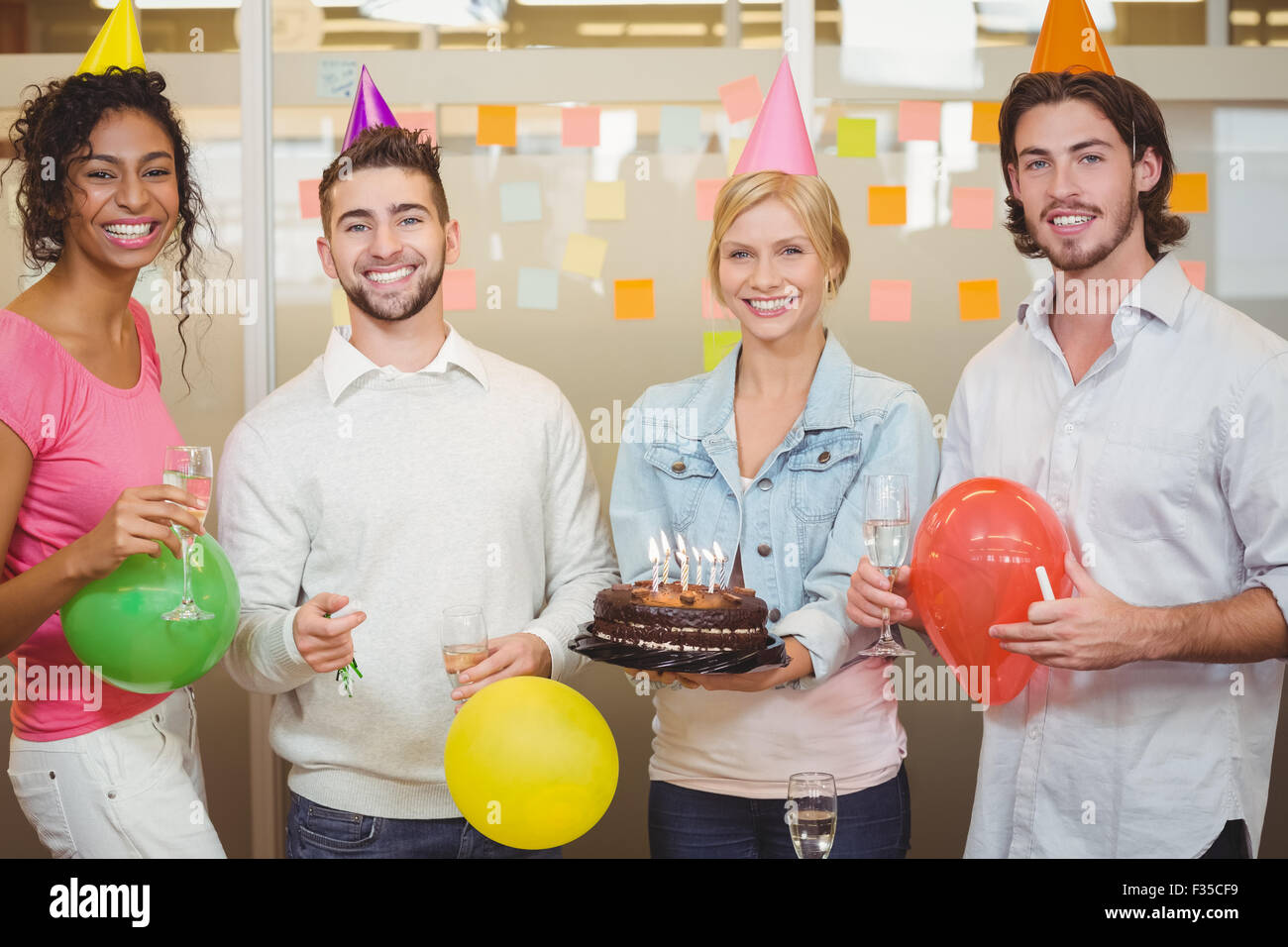 Portrait of colleagues enjoying birthday party Stock Photo - Alamy
