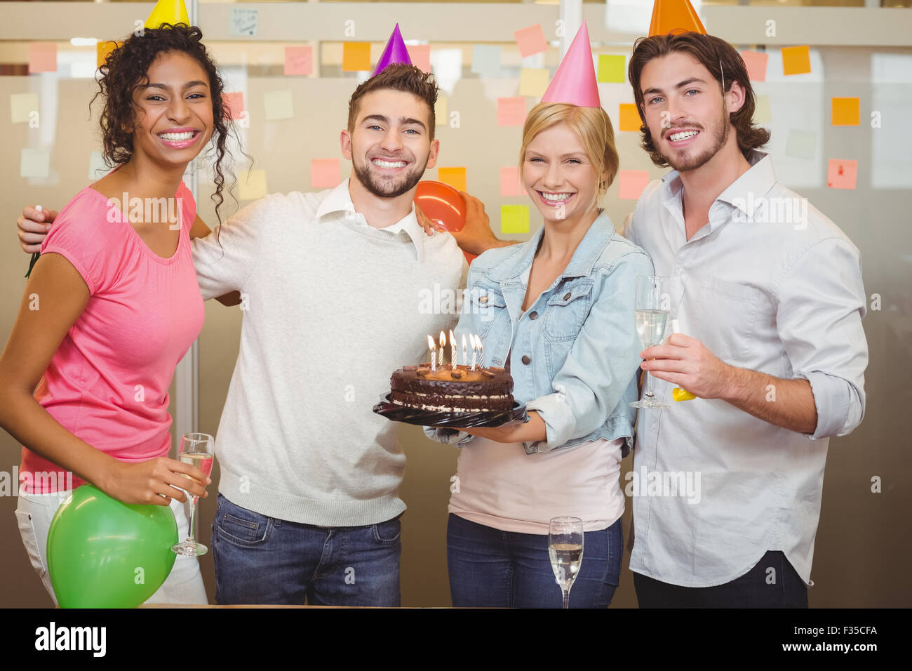 Smiling colleagues enjoying birthday party Stock Photo - Alamy