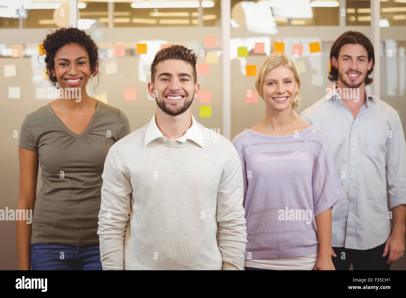 Portrait of happy colleagues in office Stock Photo - Alamy
