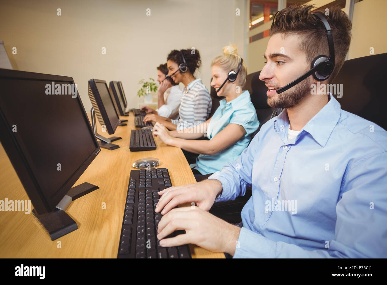 Executives working in call center Stock Photo - Alamy