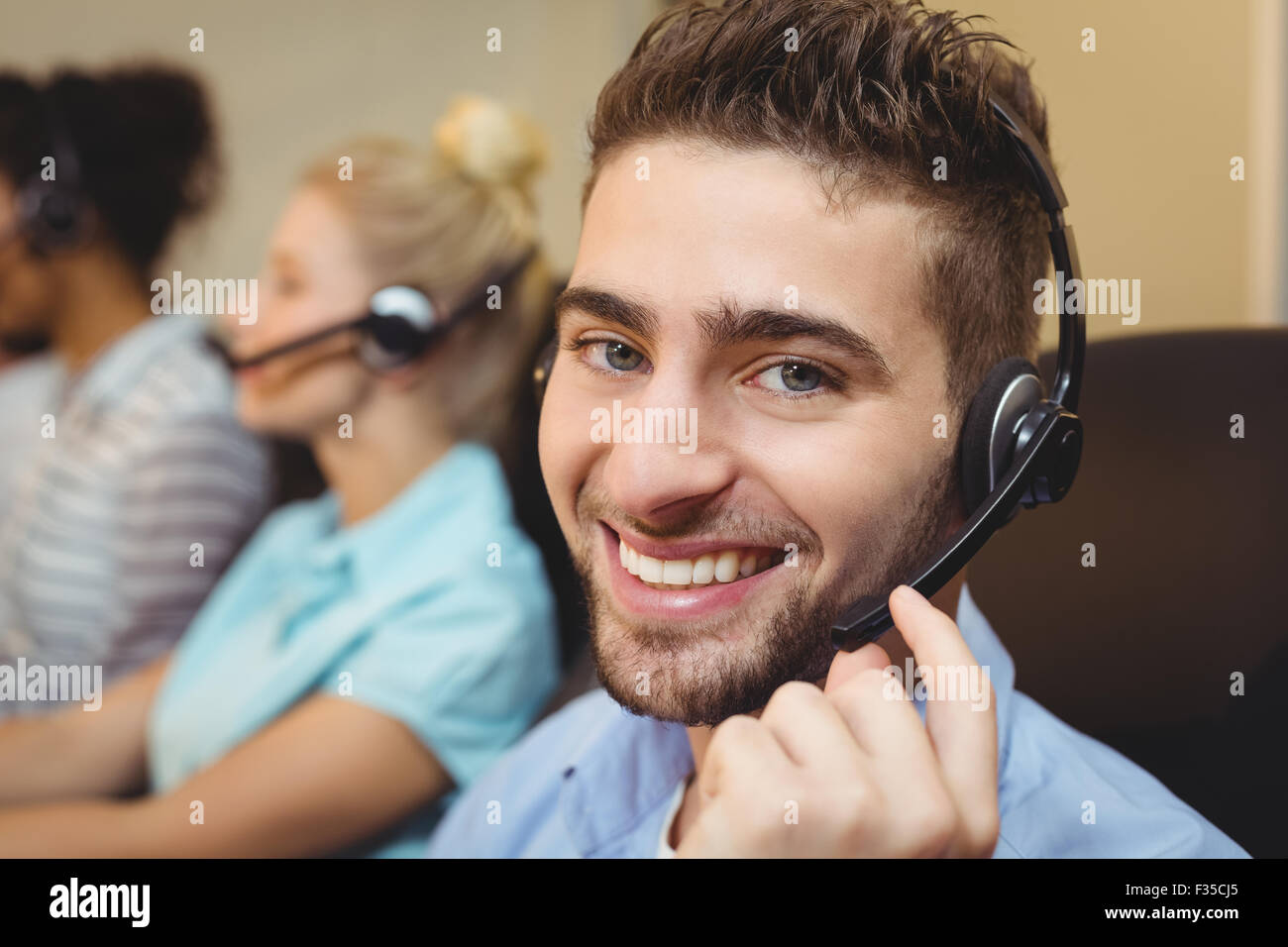 Portrait of smiling executive in call center Stock Photo - Alamy