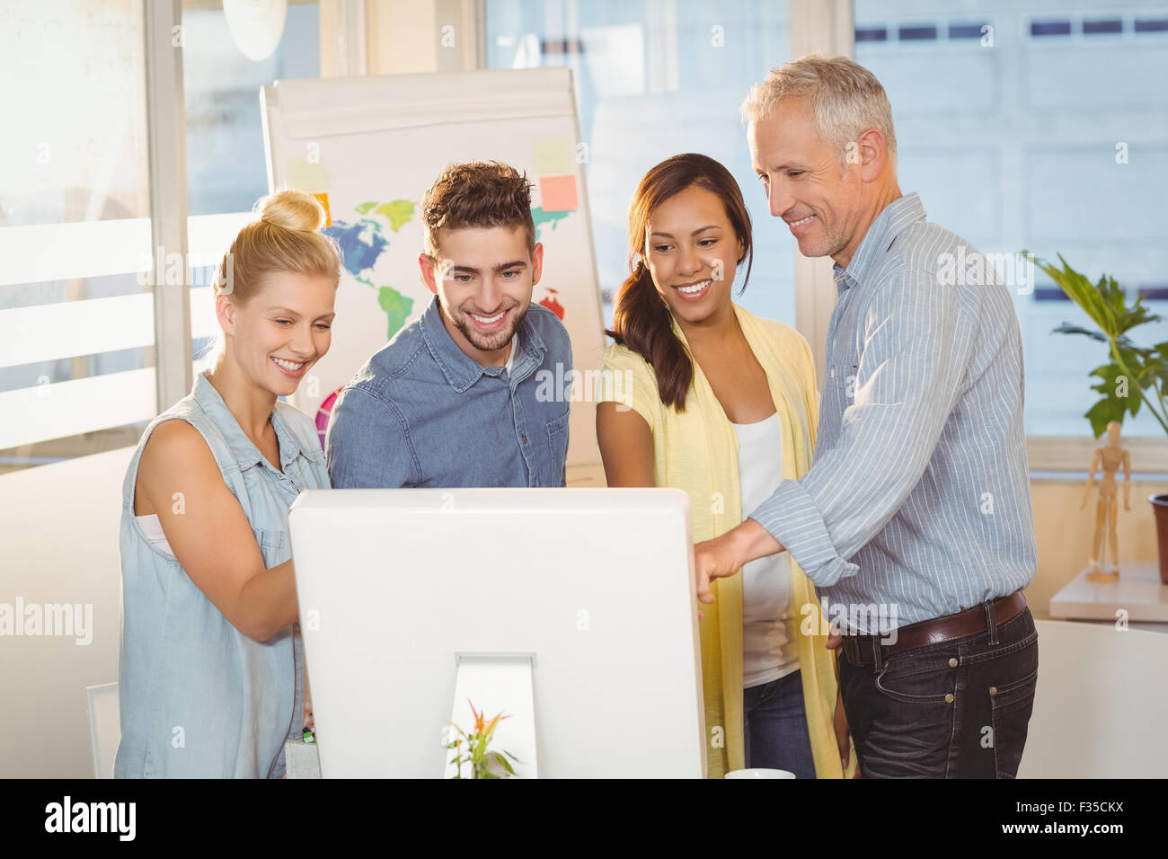 Business people using computer in meeting room Stock Photo - Alamy