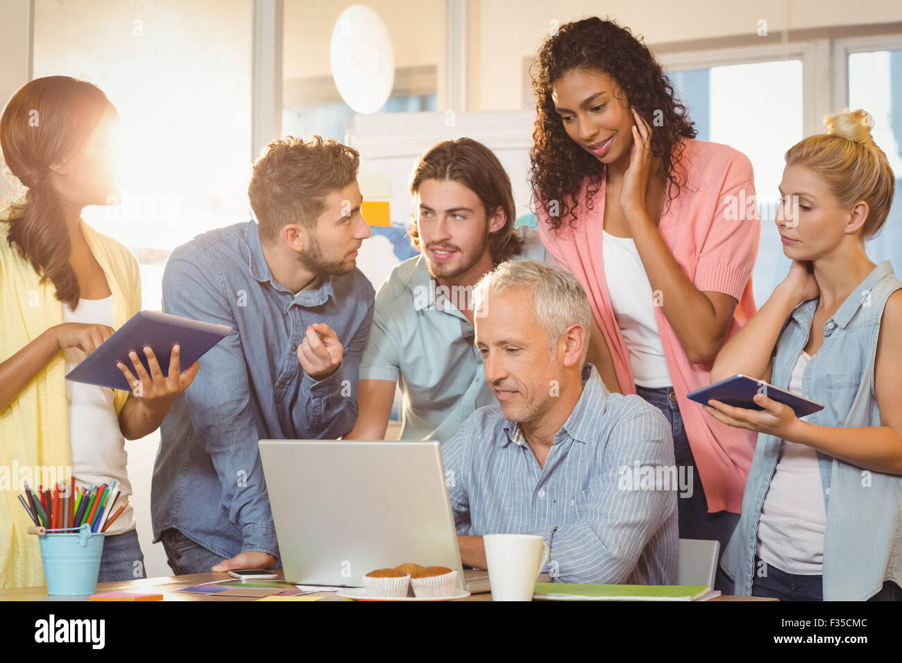 Business people discussing using technologies Stock Photo - Alamy