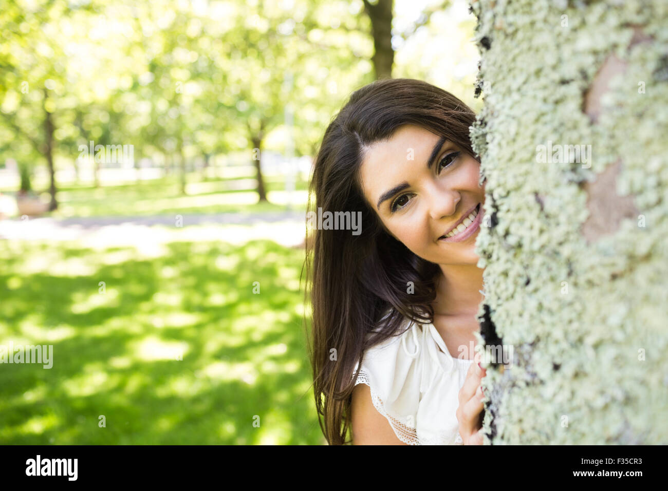 Behind tree hi-res stock photography and images - Alamy