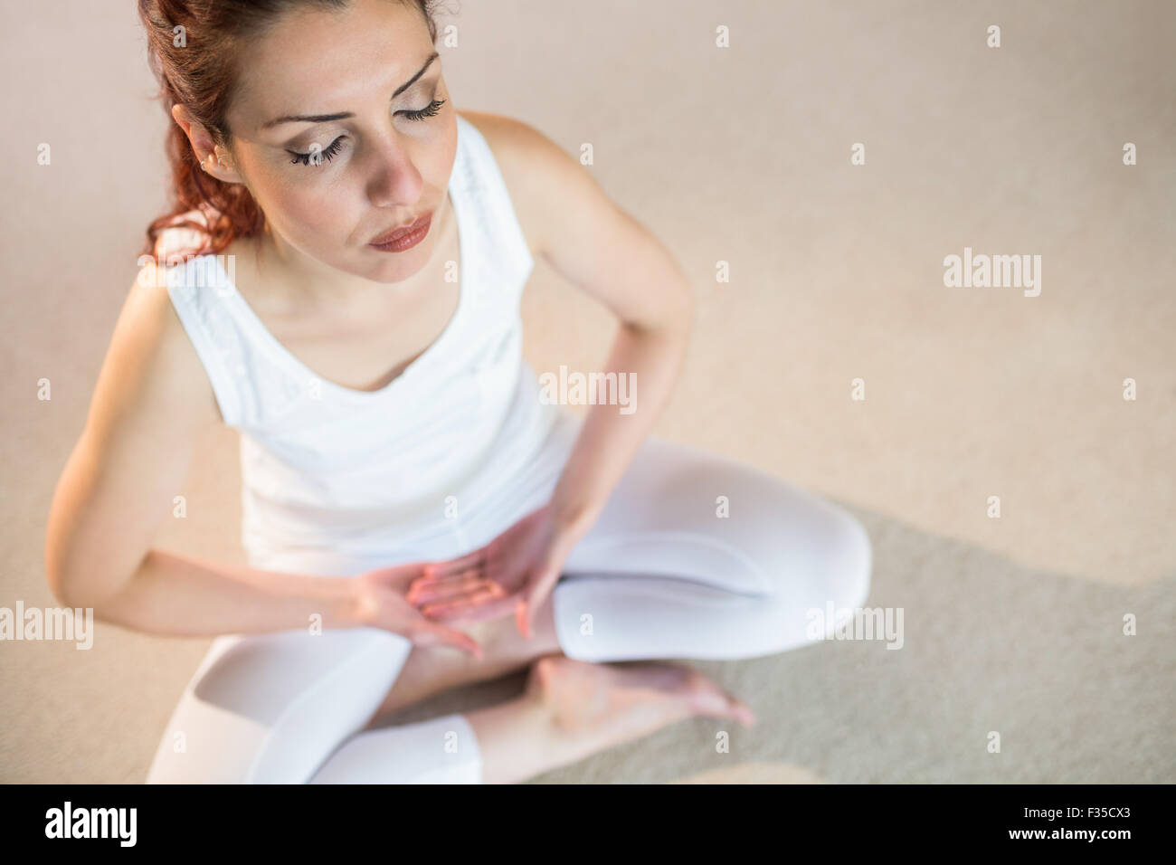 Overhead view of woman in yoga pose with eyes closed Stock Photo - Alamy