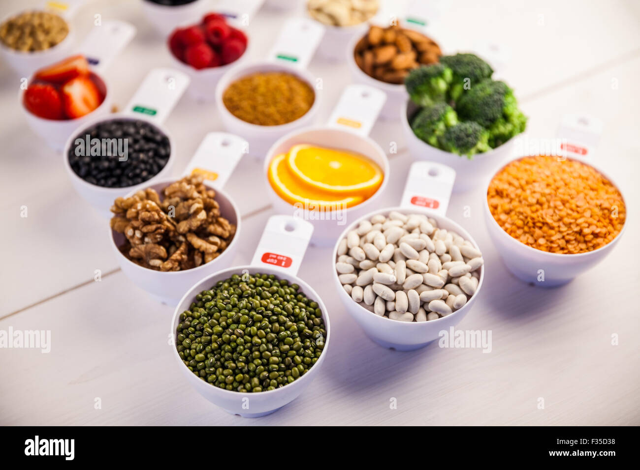 Portion cups of healthy ingredients Stock Photo - Alamy