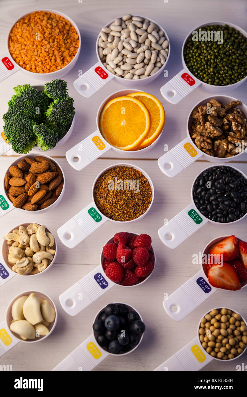 Portion cups of healthy ingredients Stock Photo - Alamy
