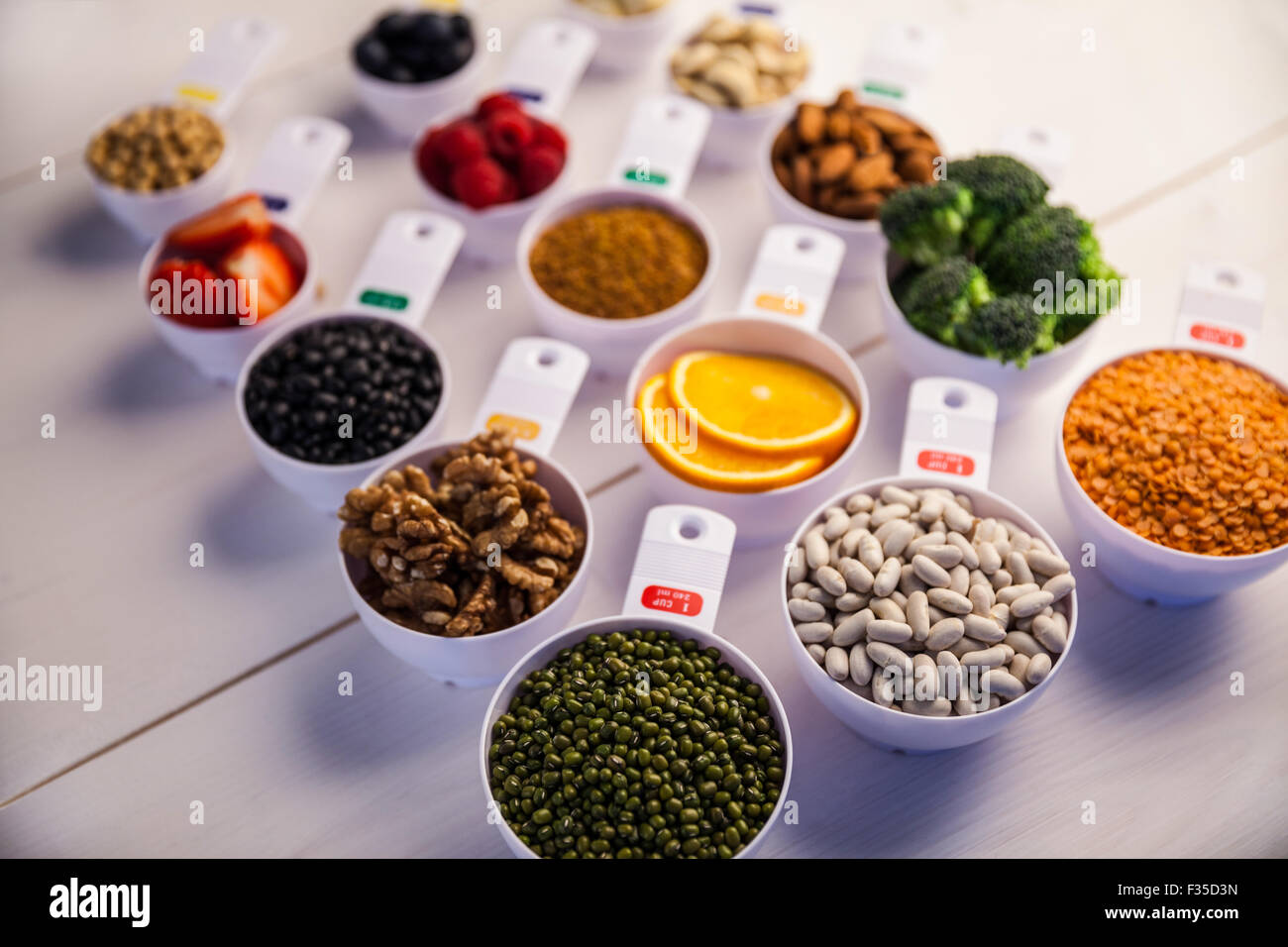Portion cups of healthy ingredients Stock Photo - Alamy