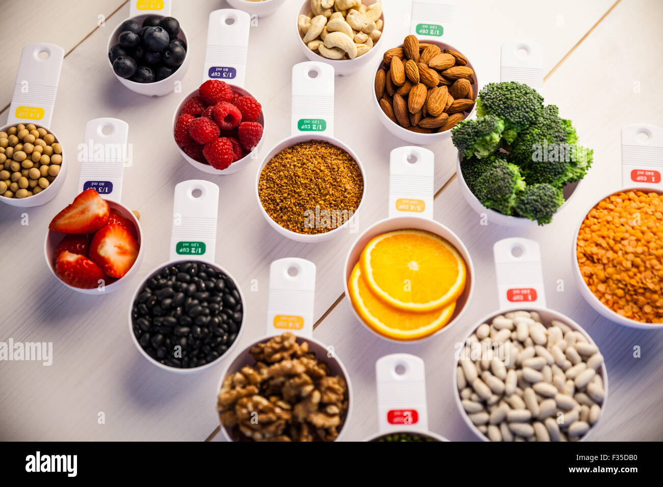 Portion cups of healthy ingredients Stock Photo - Alamy