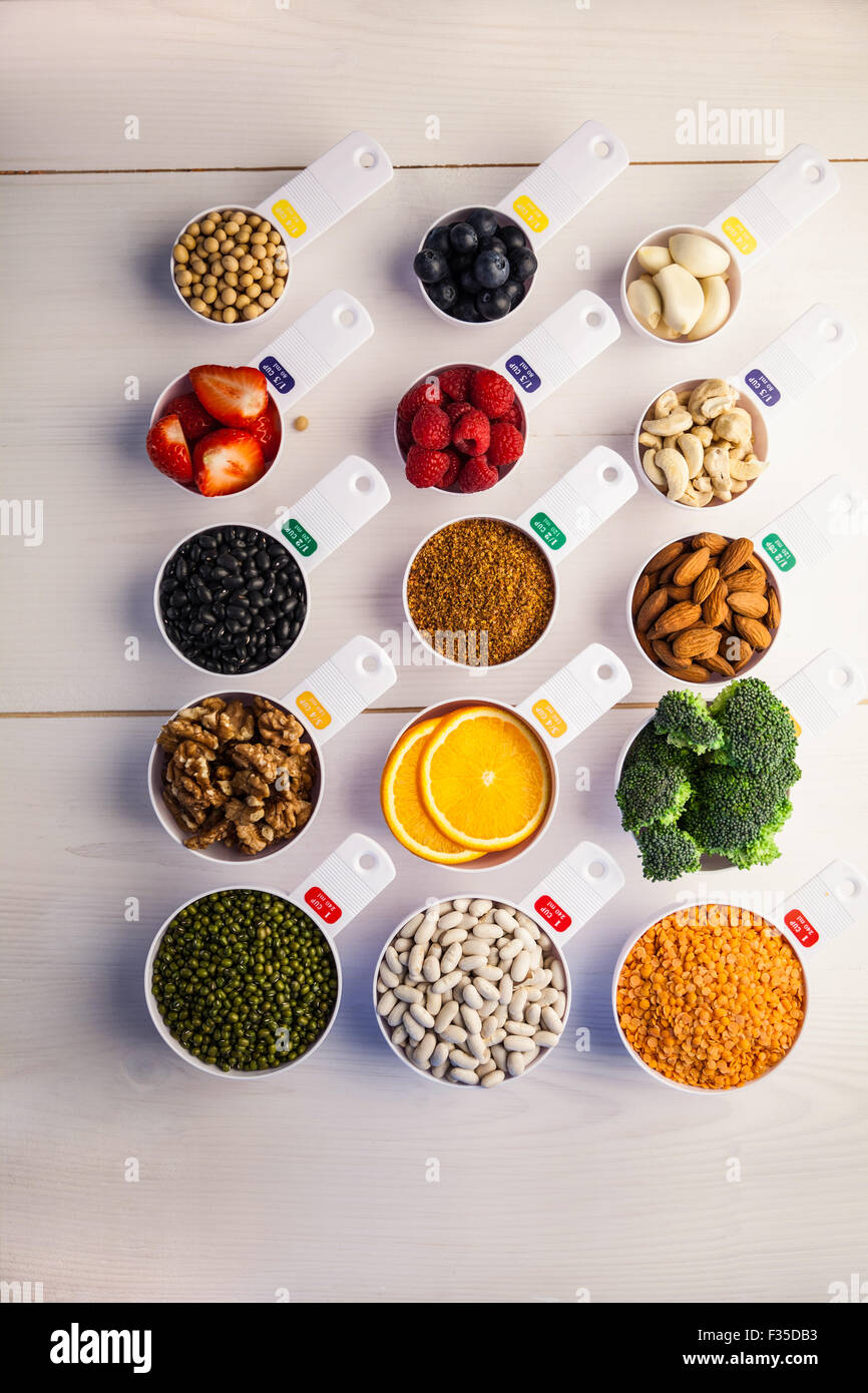Portion cups of healthy ingredients Stock Photo - Alamy