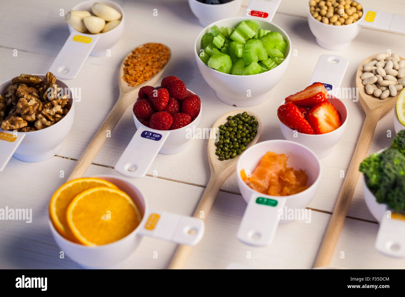 Portion cups of healthy ingredients Stock Photo - Alamy