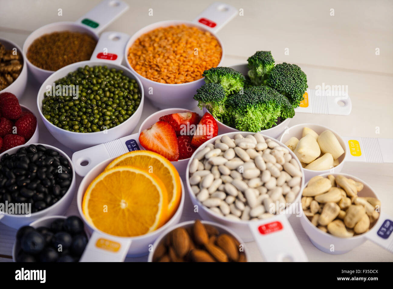Portion cups of healthy ingredients Stock Photo - Alamy
