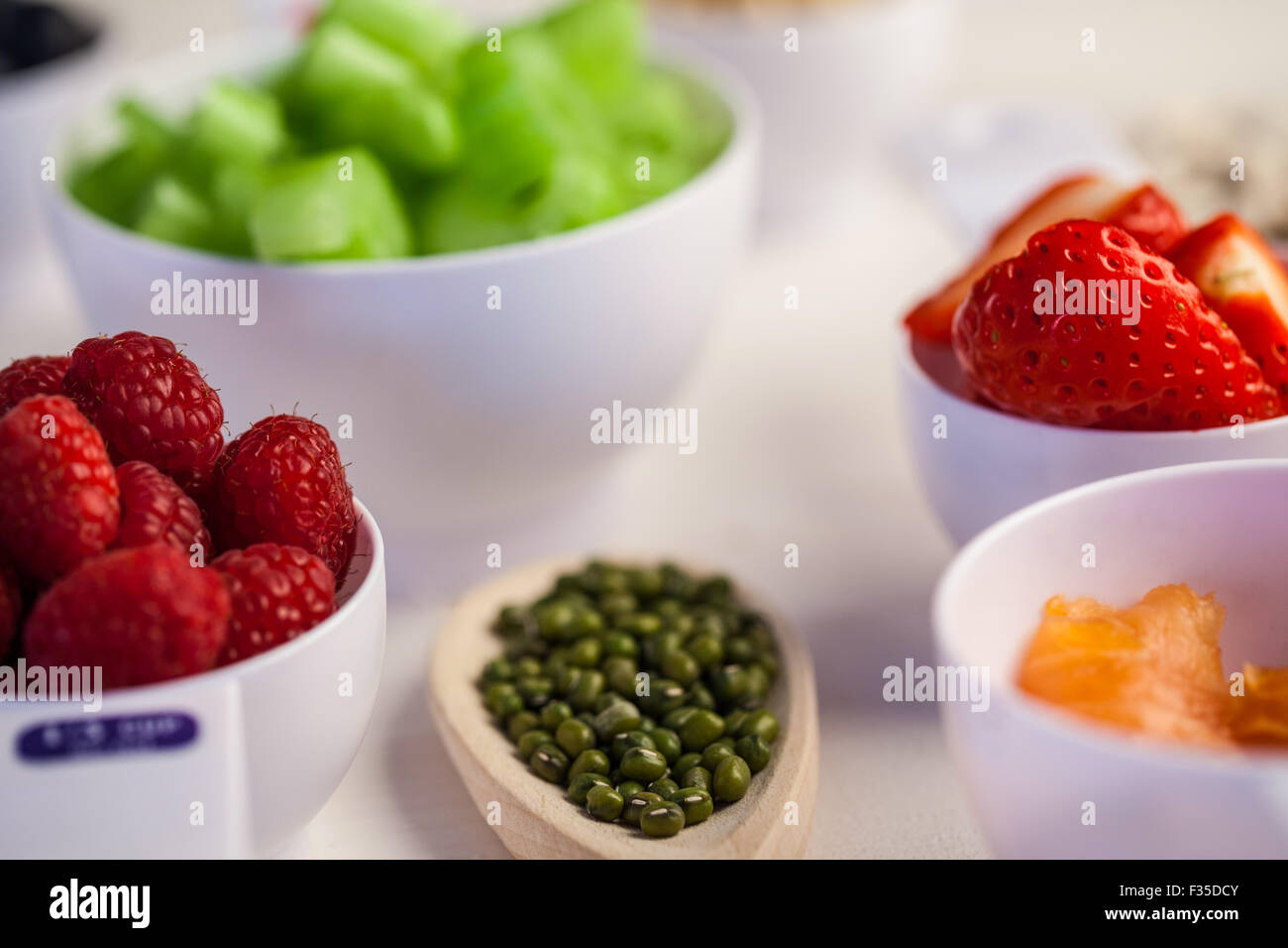 Portion cups of healthy ingredients Stock Photo - Alamy