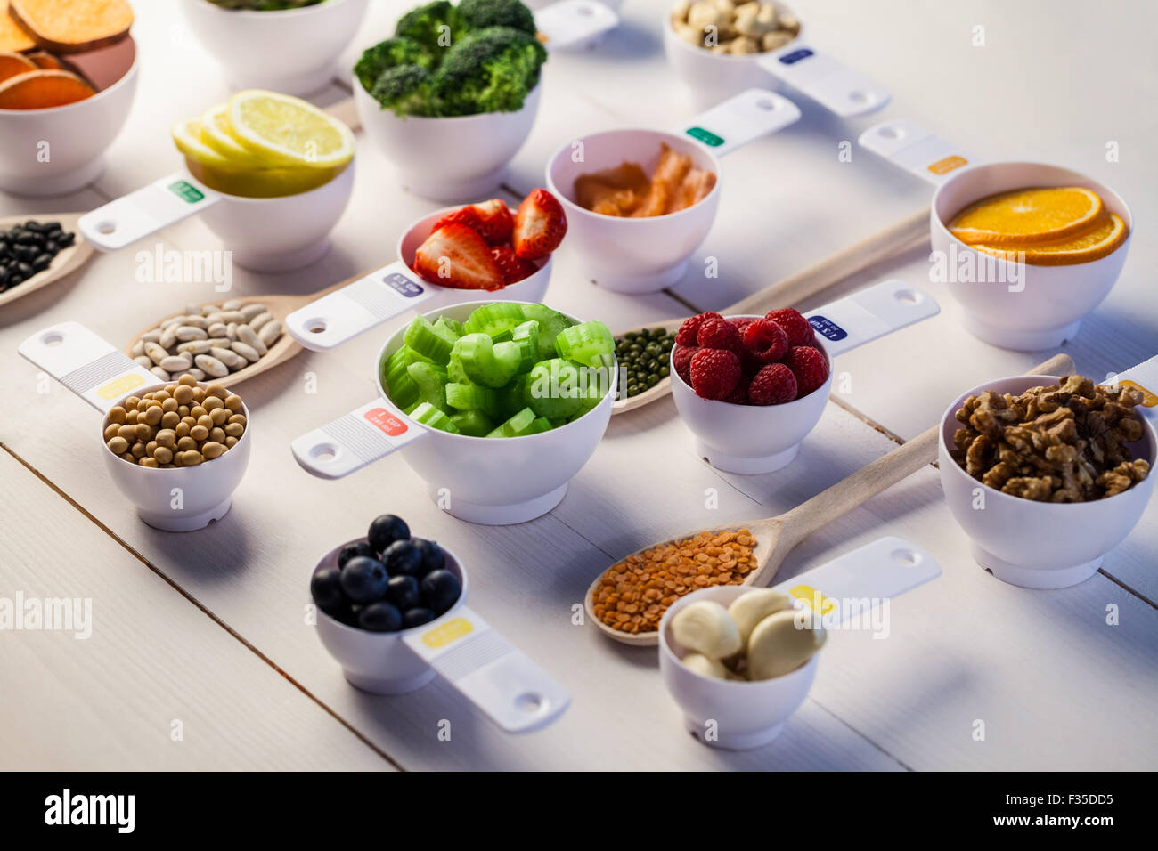 Portion cups of healthy ingredients Stock Photo - Alamy