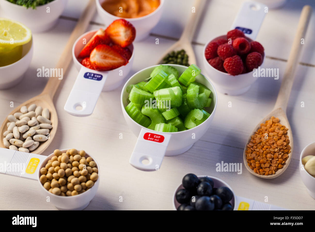 Portion cups of healthy ingredients Stock Photo - Alamy