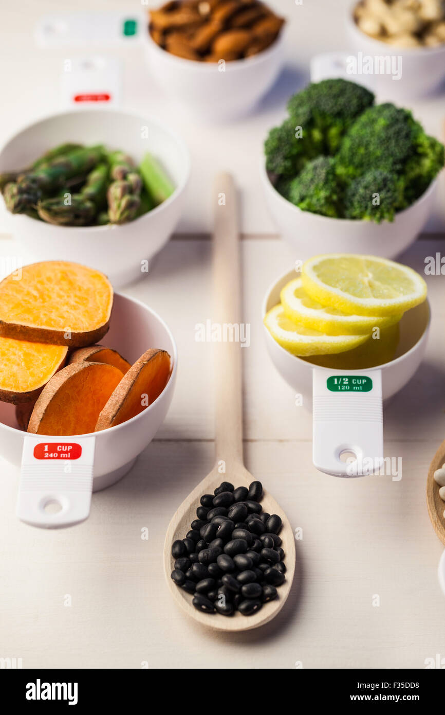 Portion cups of healthy ingredients Stock Photo - Alamy