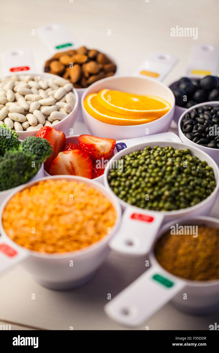 Portion cups of healthy ingredients Stock Photo - Alamy