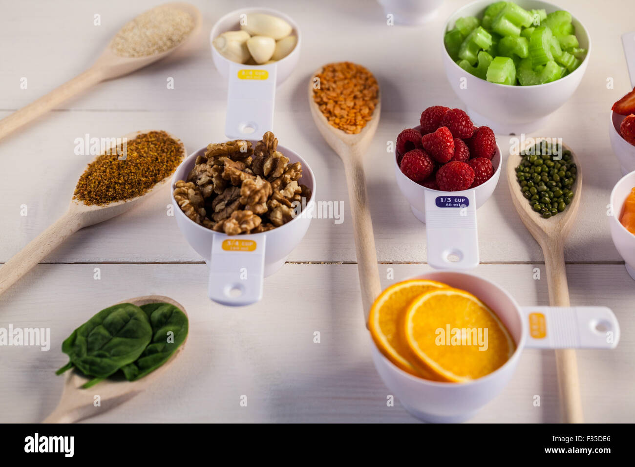 Portion cups of healthy ingredients Stock Photo - Alamy