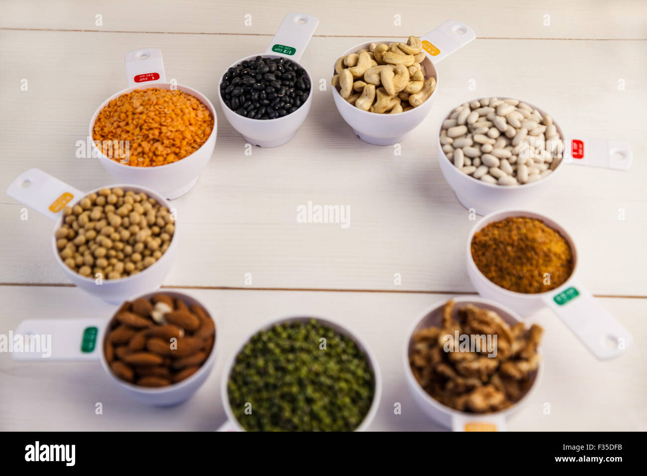 Portion cups of healthy ingredients Stock Photo - Alamy