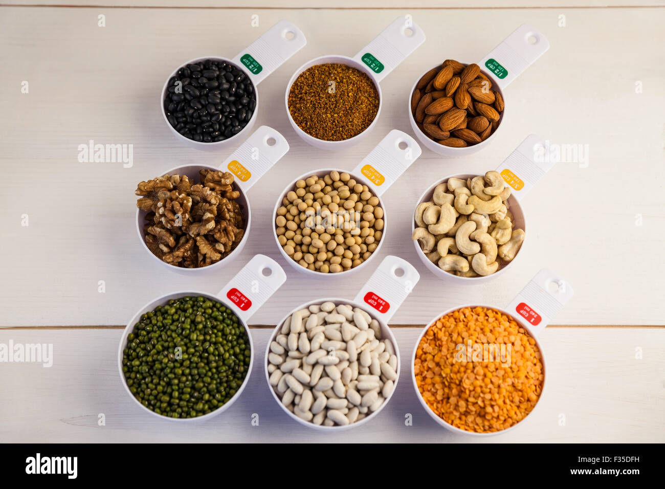 Portion cups of healthy ingredients Stock Photo - Alamy