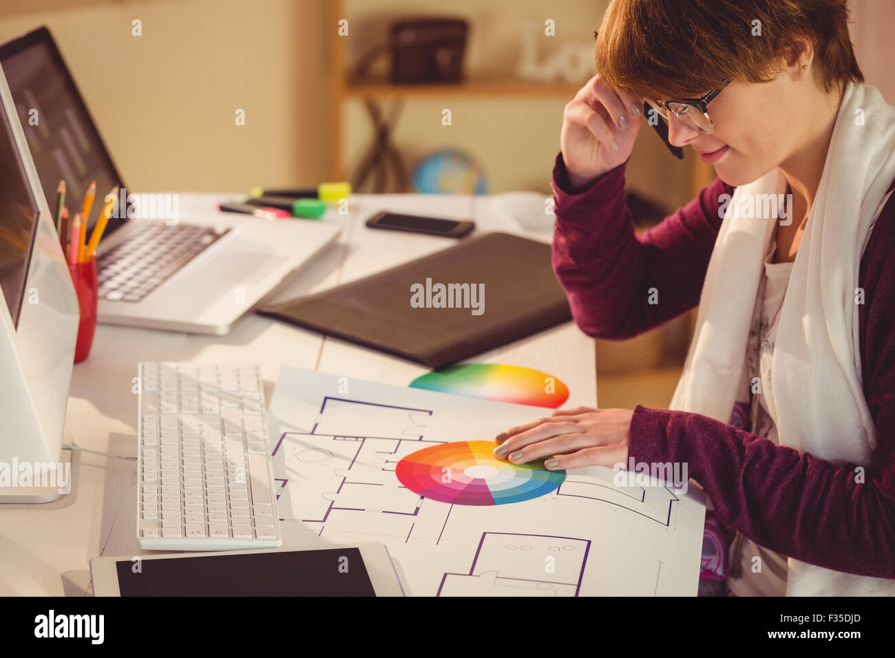 Graphic designer working at desk Stock Photo - Alamy
