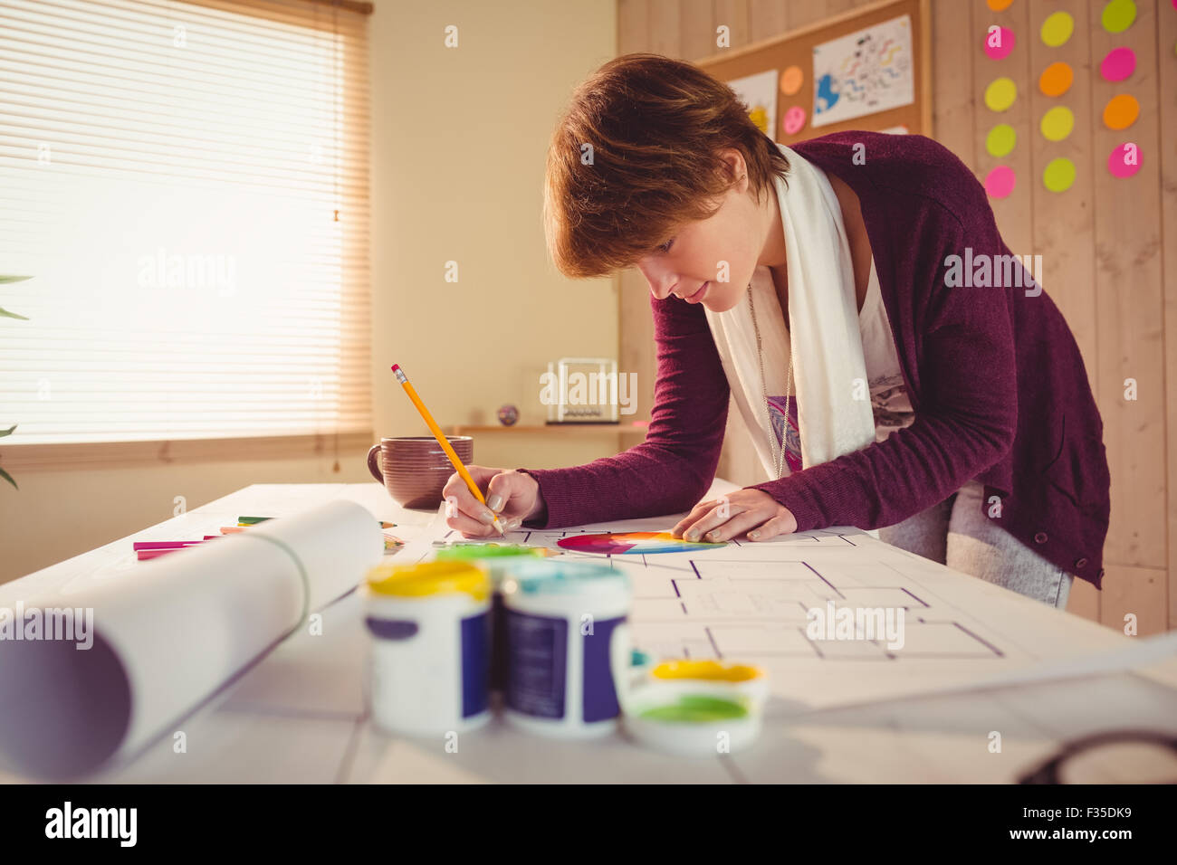 Graphic designer working at desk Stock Photo - Alamy