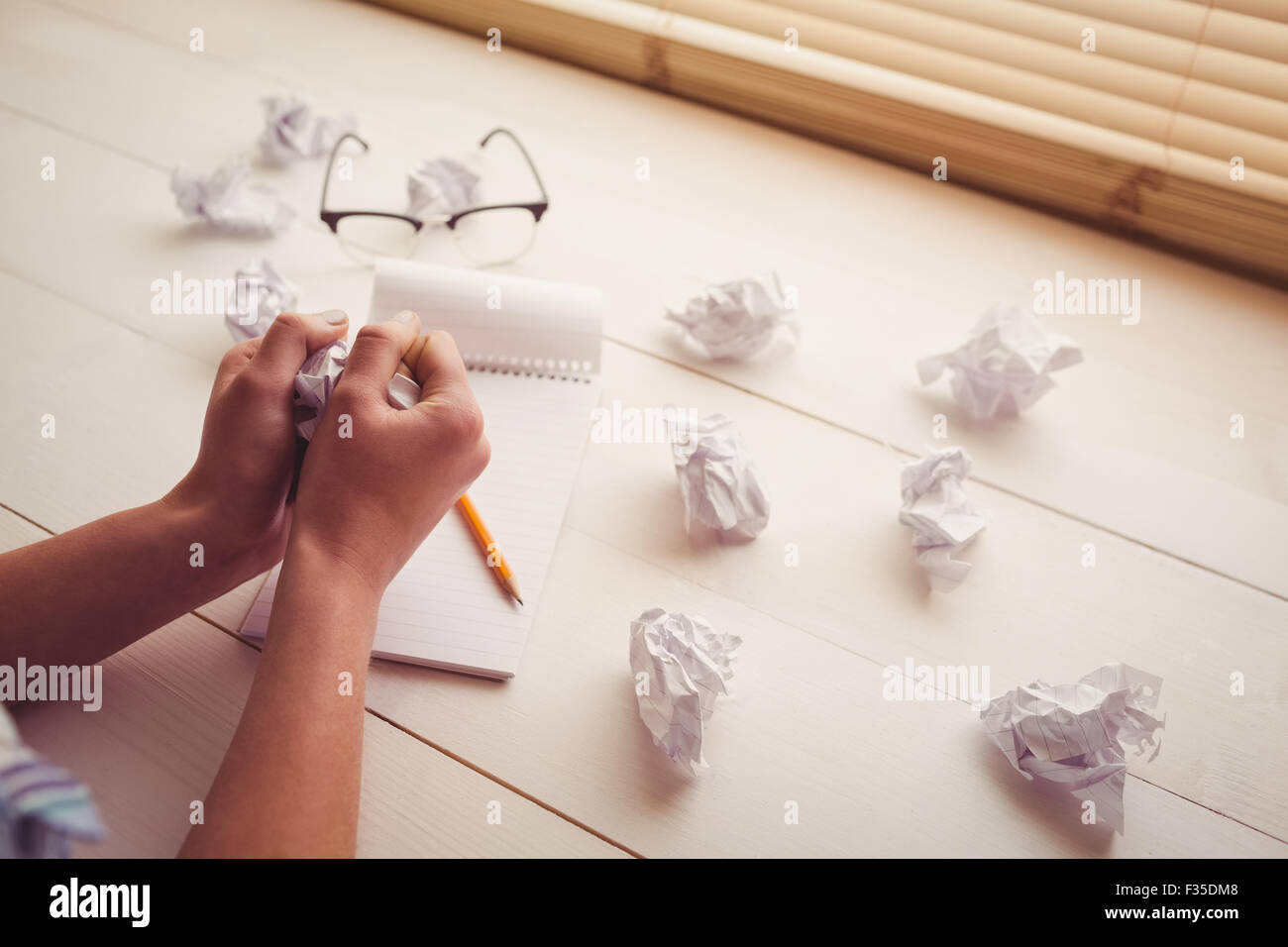 Woman Crumpling Paper Stock Photos & Woman Crumpling Paper Stock Images ...