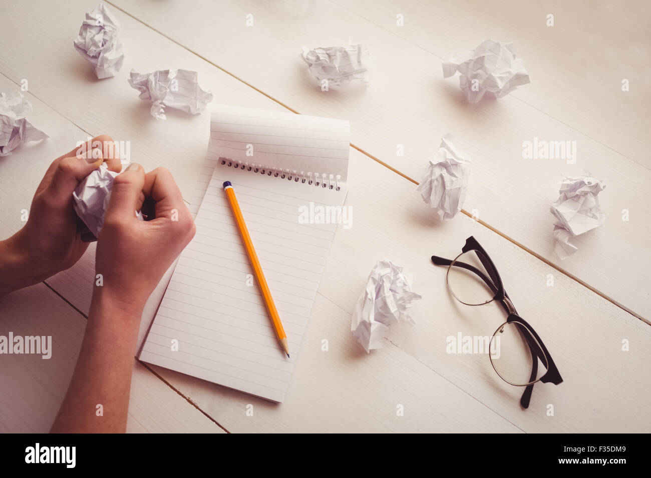 Woman crumpling paper hi-res stock photography and images - Alamy