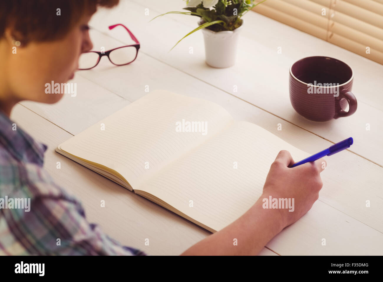 Young adult writing notes hi-res stock photography and images - Alamy