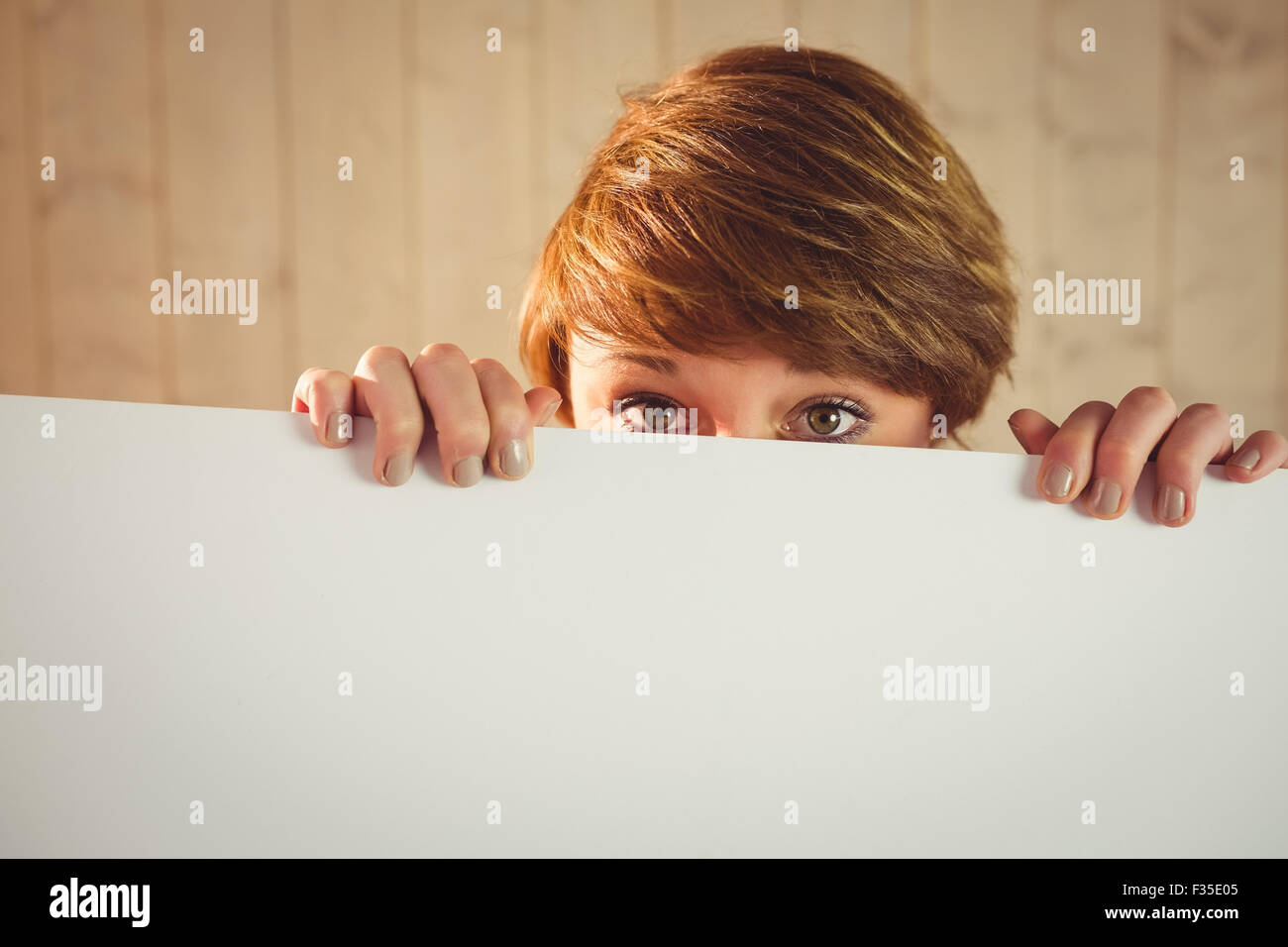 Woman hiding behind wall hi-res stock photography and images - Alamy