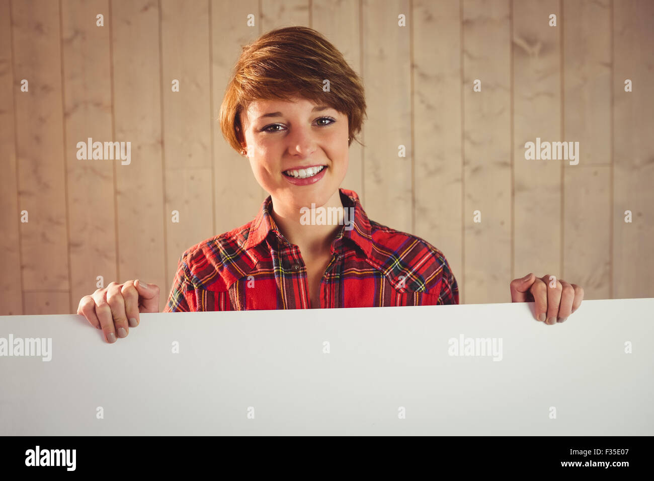 Pretty young woman holding sign Stock Photo - Alamy